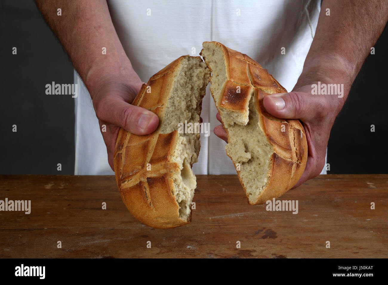 Breaking of a fresh loaf of Eucharistic bread in Zagreb, Croatia on ...