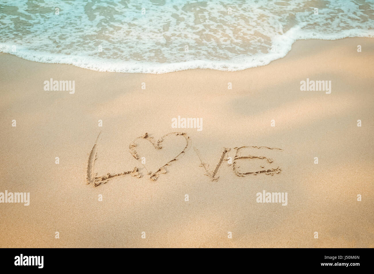 Alphabet writing on sand letter hi-res stock photography and images - Alamy