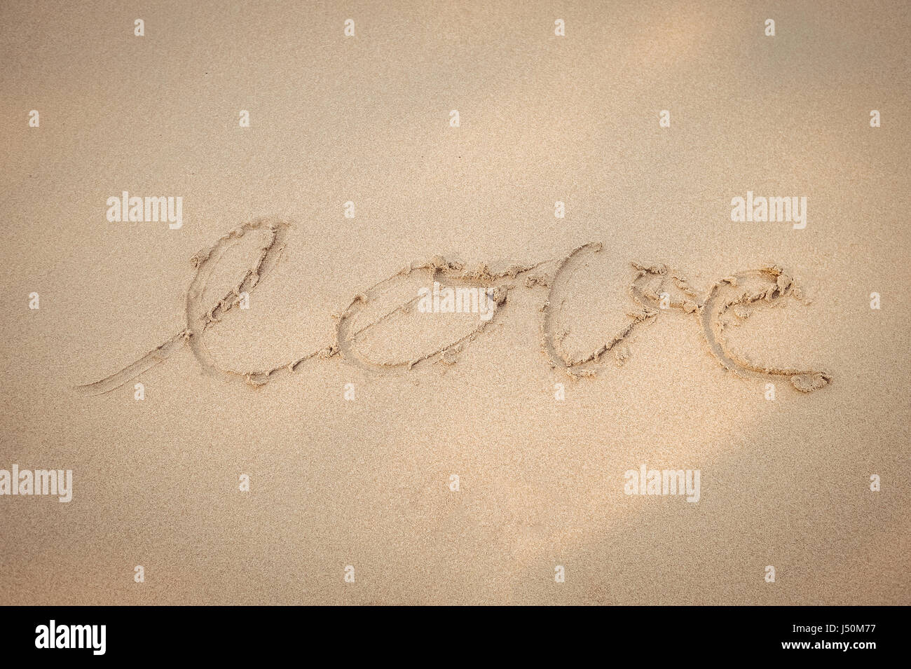 Alphabet writing on sand letter hi-res stock photography and images - Alamy