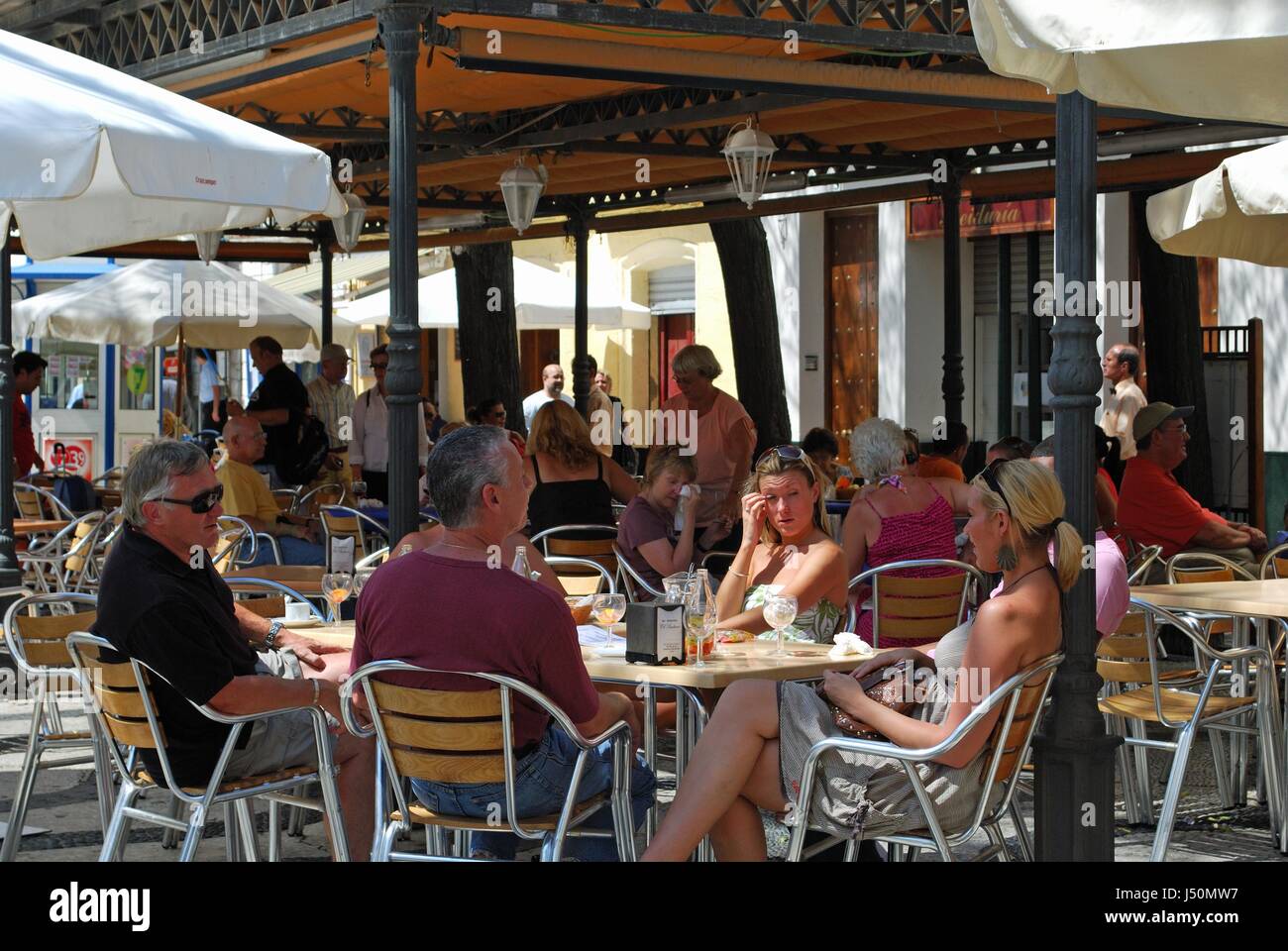 Tourists relaxing at a pavement city centre cafe, Cadiz, Cadiz Province ...