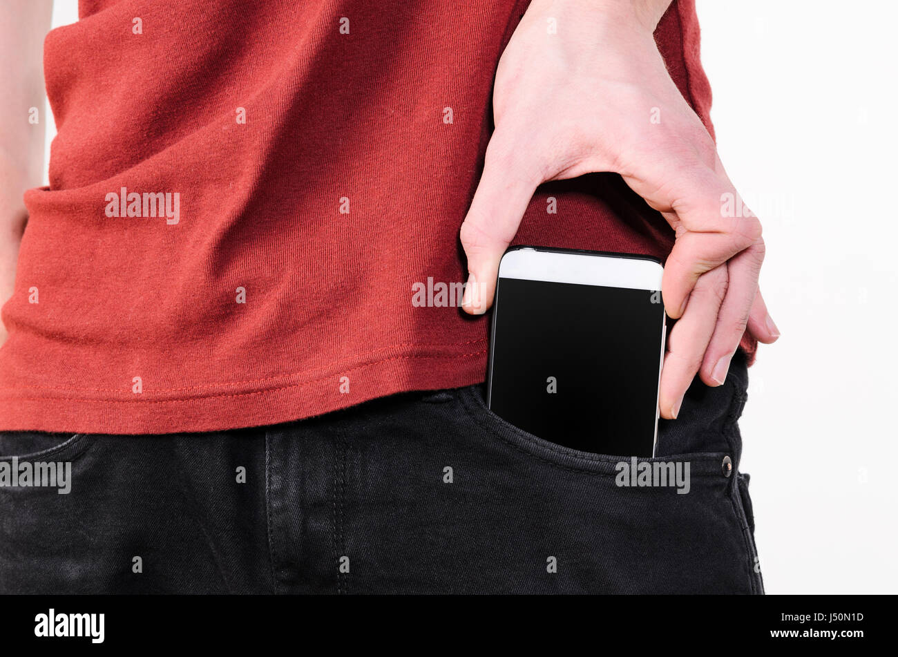 Mobile phone in a pocket Stock Photo - Alamy