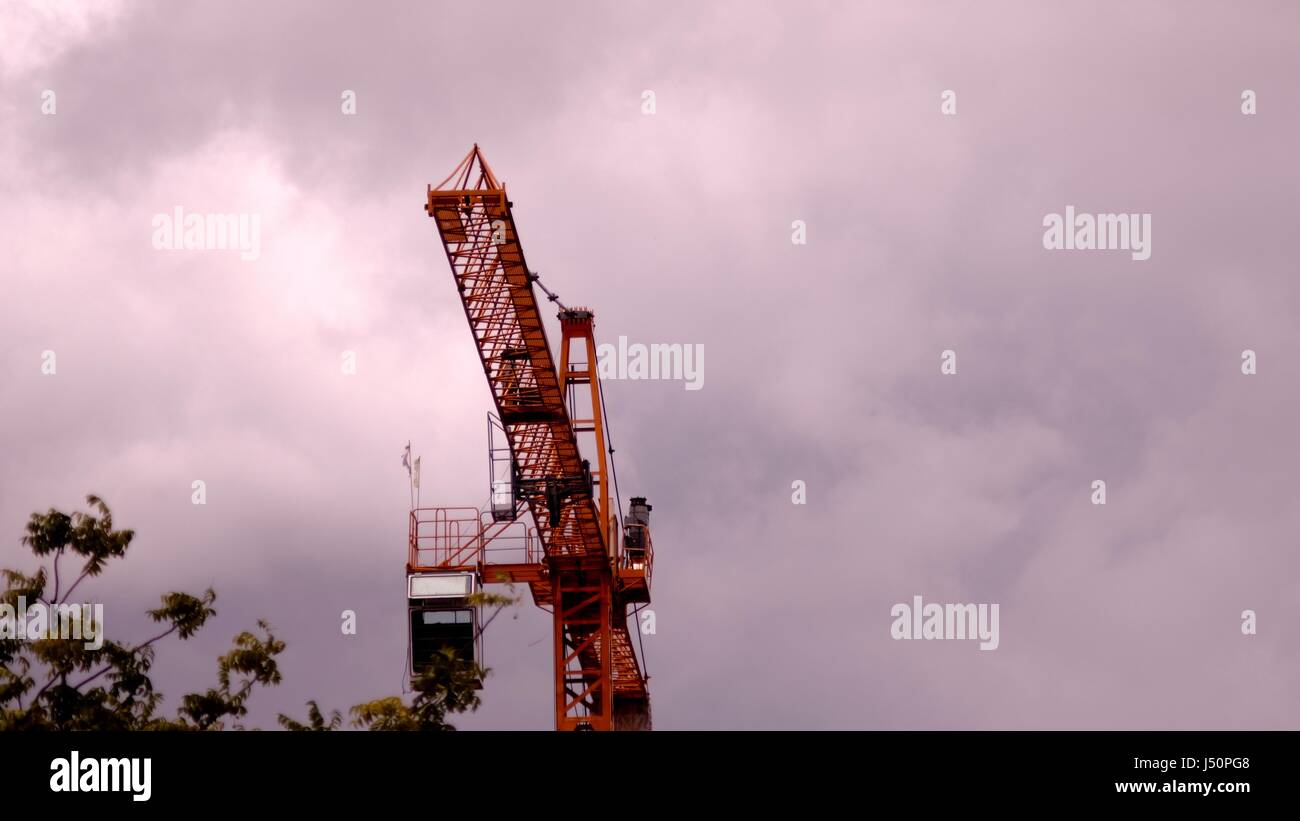 Construction Crane Derrick Climbing System Against the Cloudy Sky in ...