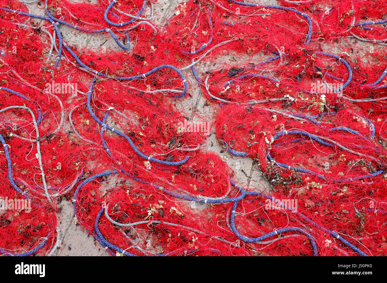 colourful red fishing nets forming pattern Stock Photo - Alamy