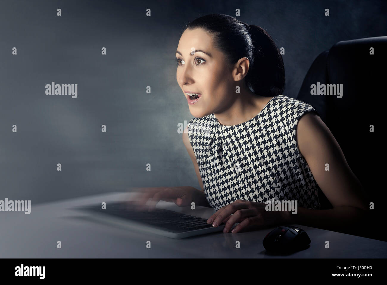 Woman using computer Stock Photo - Alamy