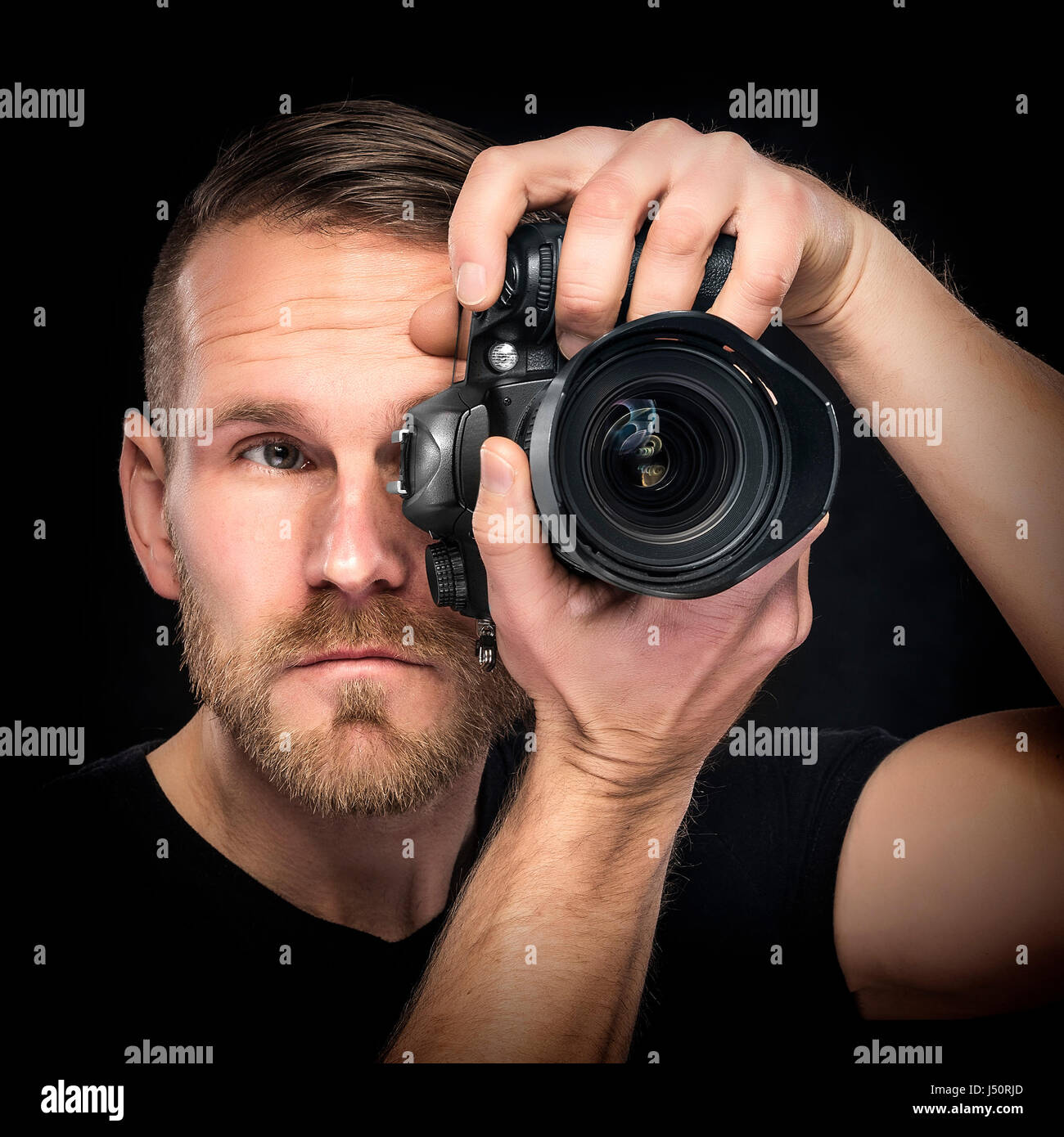 Photographer with camera on black Stock Photo - Alamy