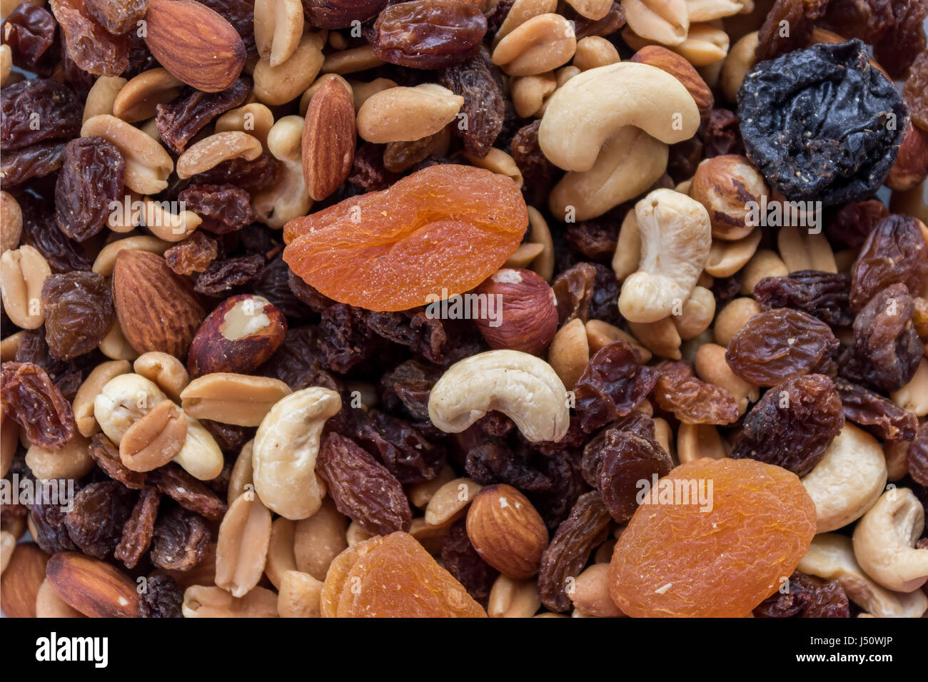 Assorted nuts and dry fruit background Stock Photo - Alamy