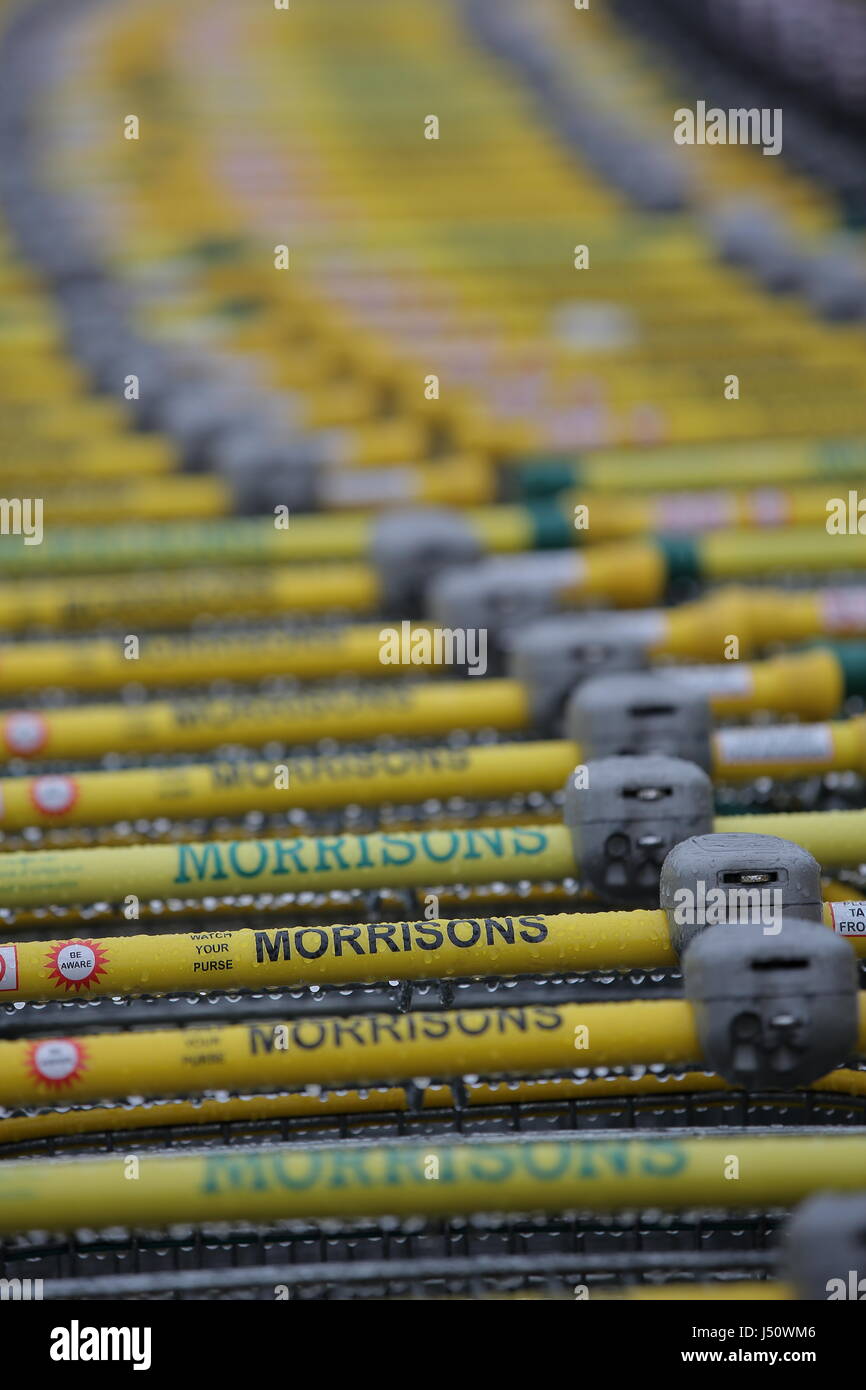 Shopping trolleys' handlebars and coin receivers at a Morrisons super ...