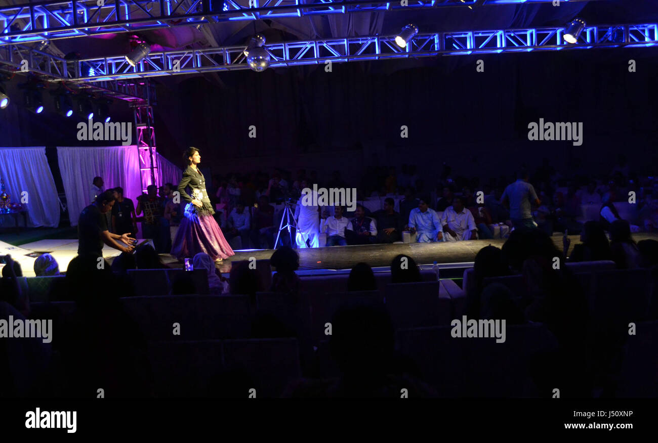 A model give pose on the ramp during the fashion show in Hyderabad ...