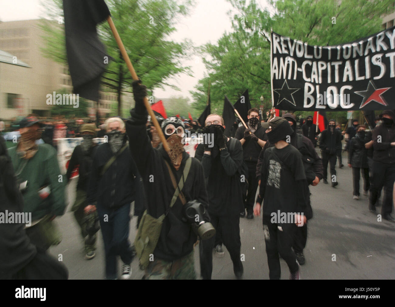 Black Bloc Anarchists Blocking Street. Protesters block streets and ...