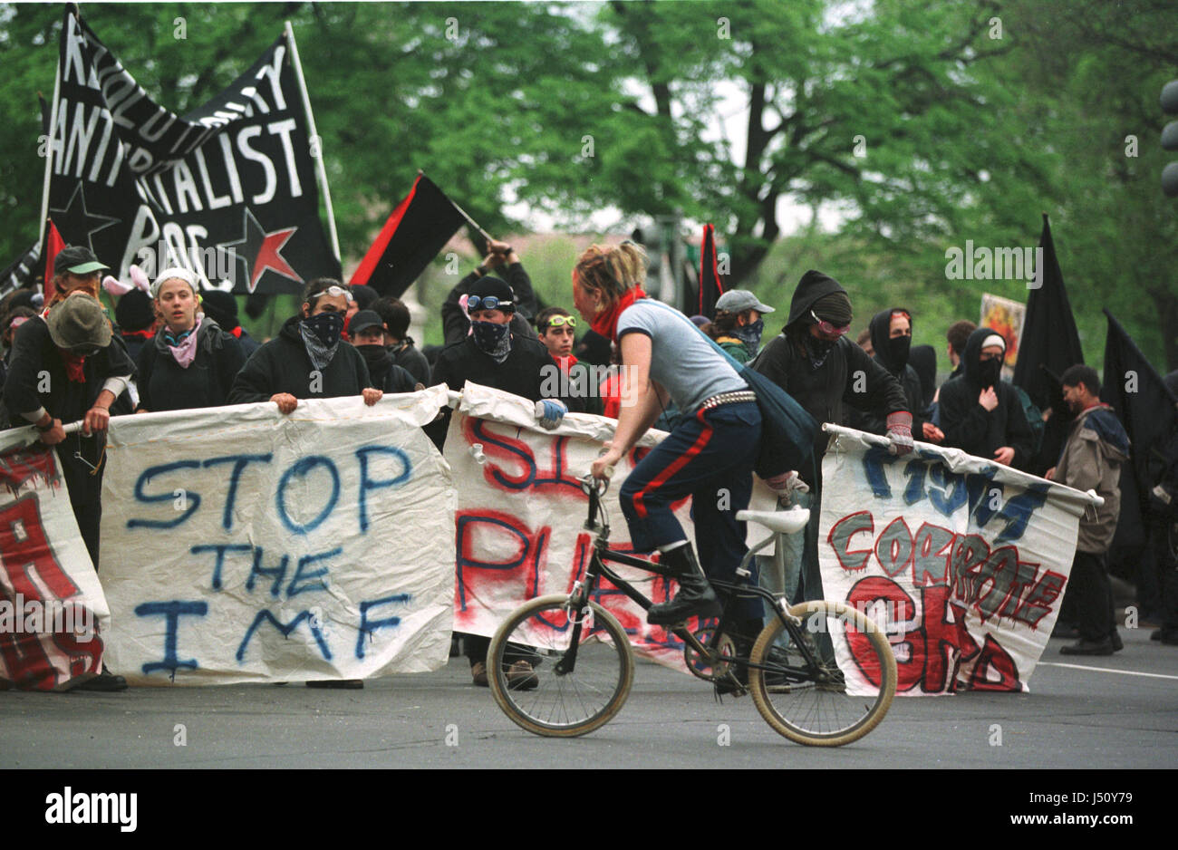 Black Bloc Anarchists Blocking Street. Protesters block streets and ...
