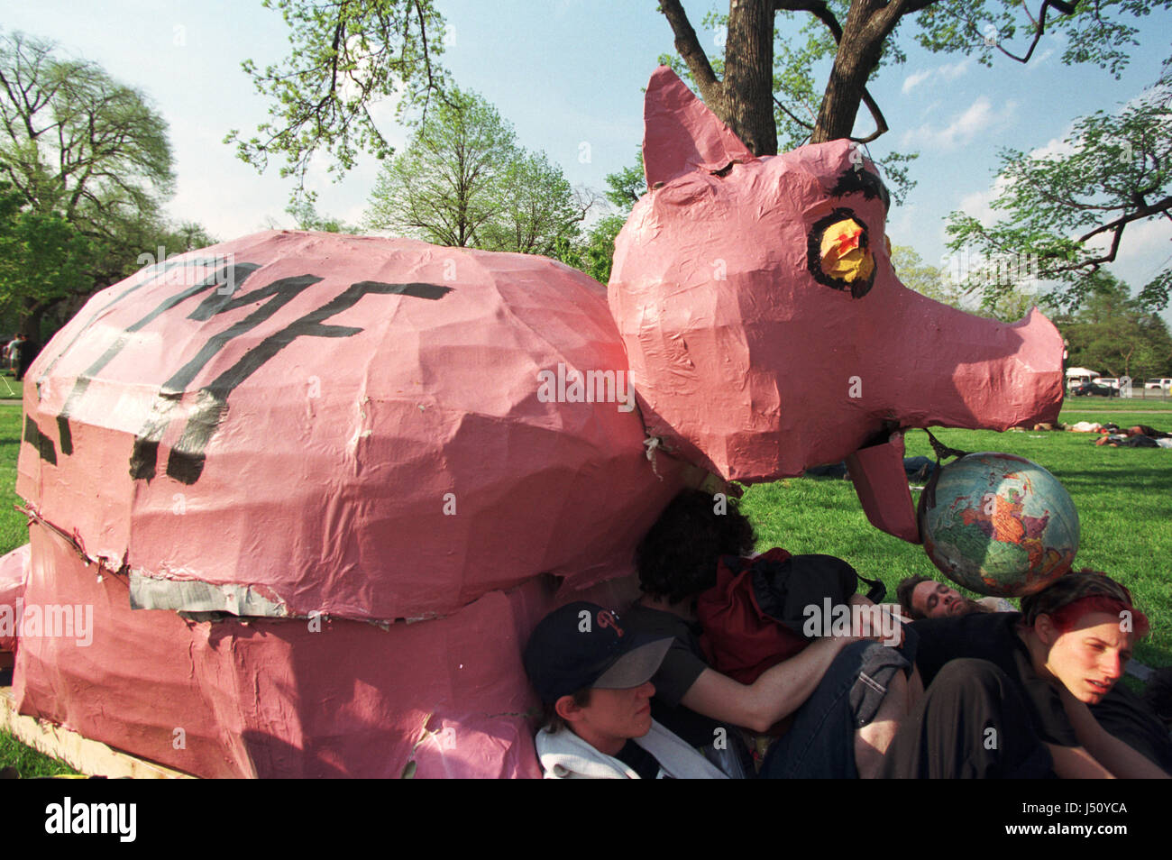 Capitalist Pig Puppet with Protesters sleeping underneath. Protesters ...