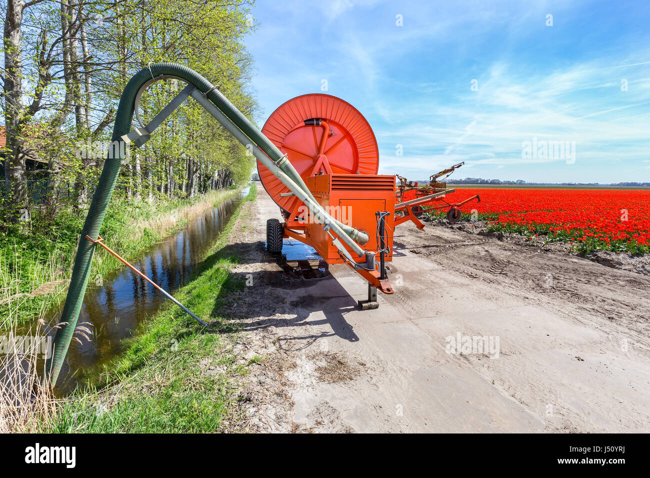 Water road sprinkler hi-res stock photography and images - Alamy