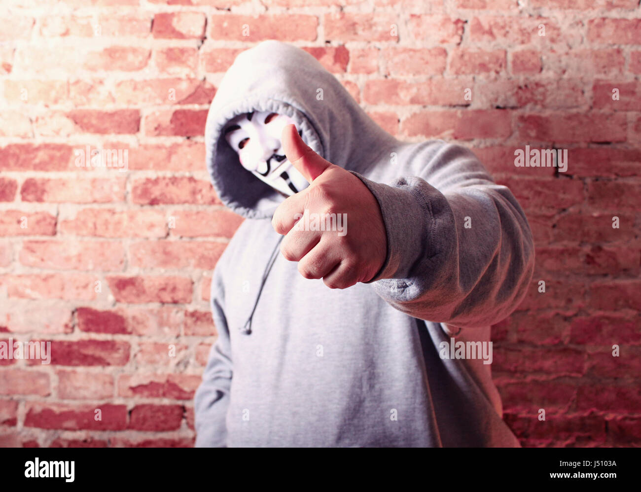 Man hand thumbs up brick hi-res stock photography and images - Alamy