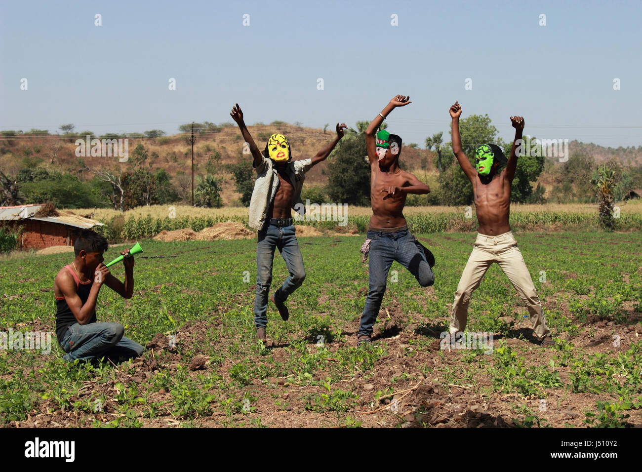 Rural tribal children playing Holi. Gujarat, India Stock Photo - Alamy