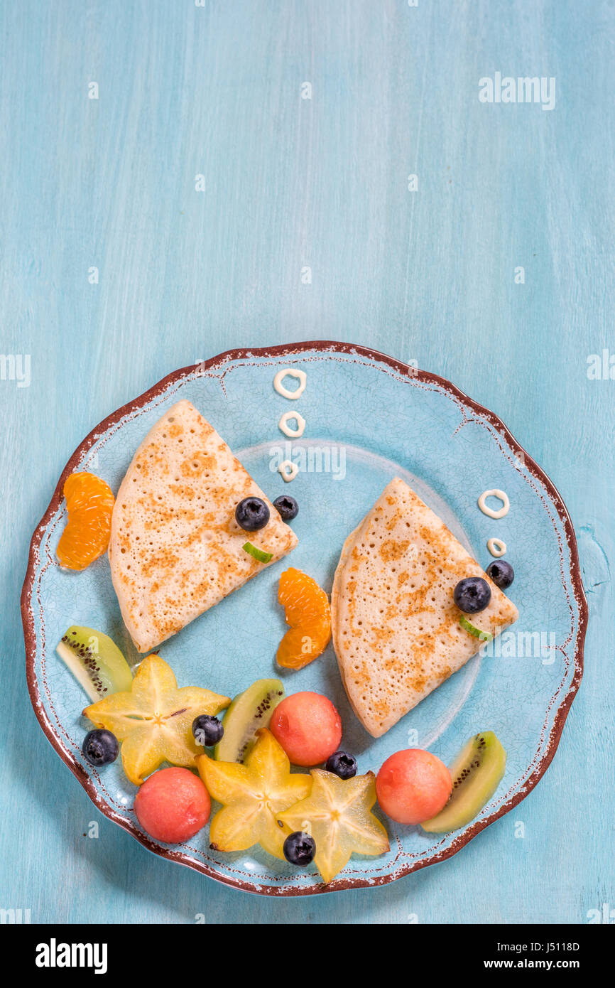 Funny crepes pancakes looks like a fish Stock Photo - Alamy