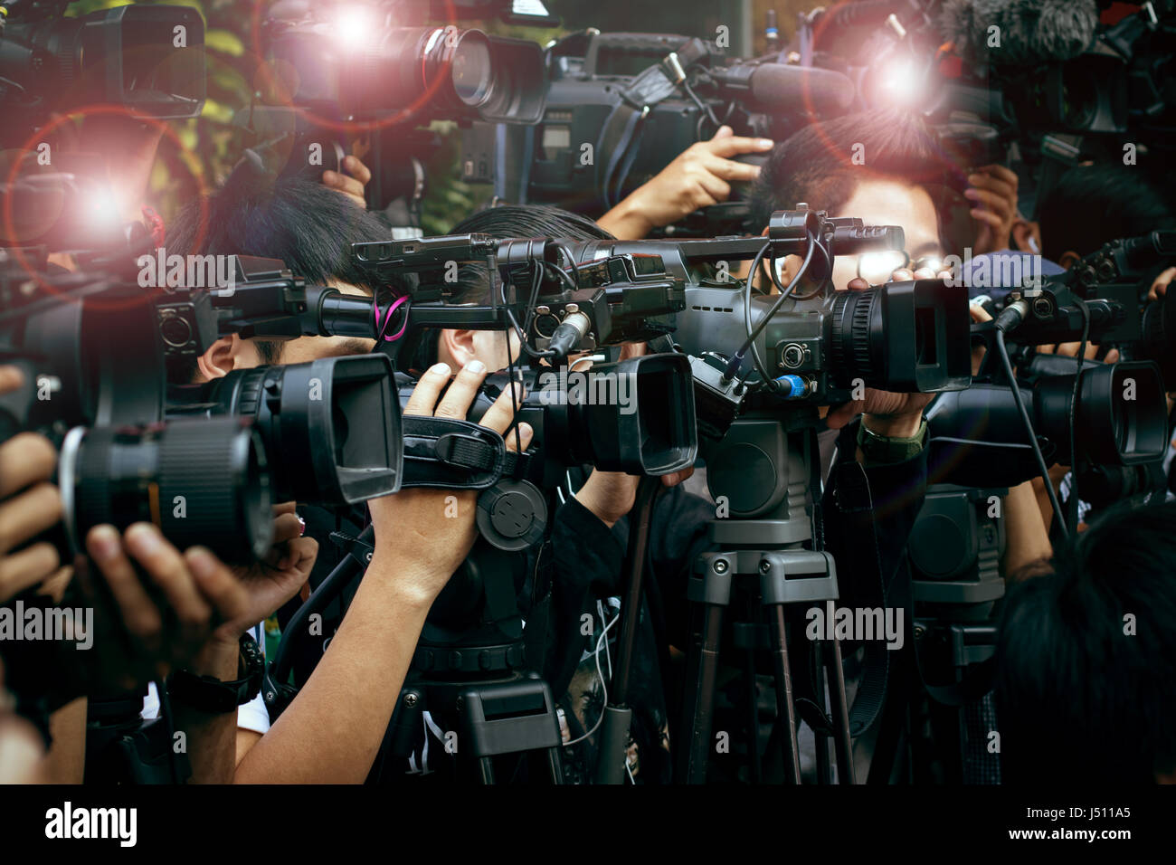 press and media camera ,video photographer on duty in public news ...