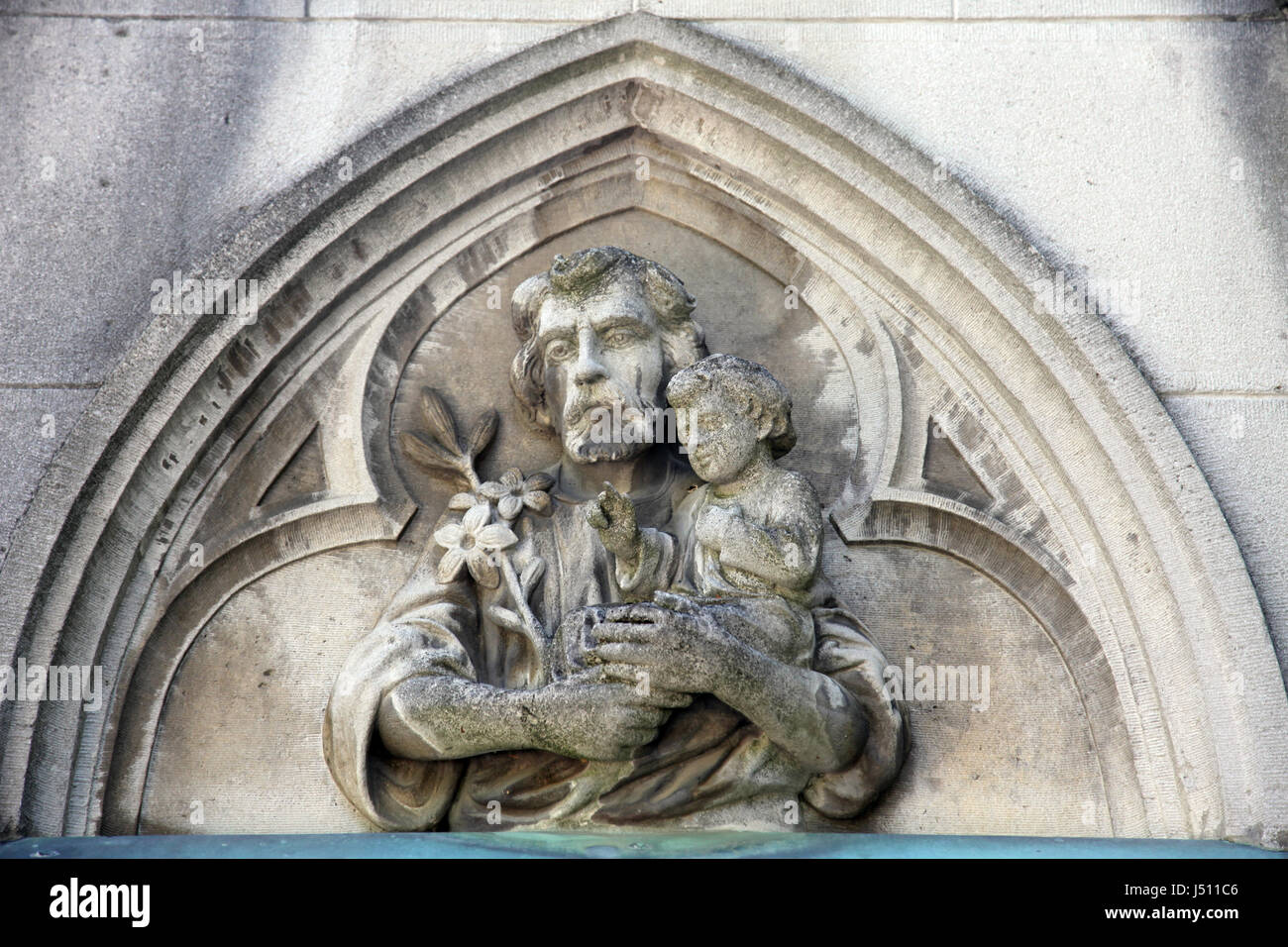 Saint Joseph holding child Jesus, headstone on Mirogoj cemetery in ...