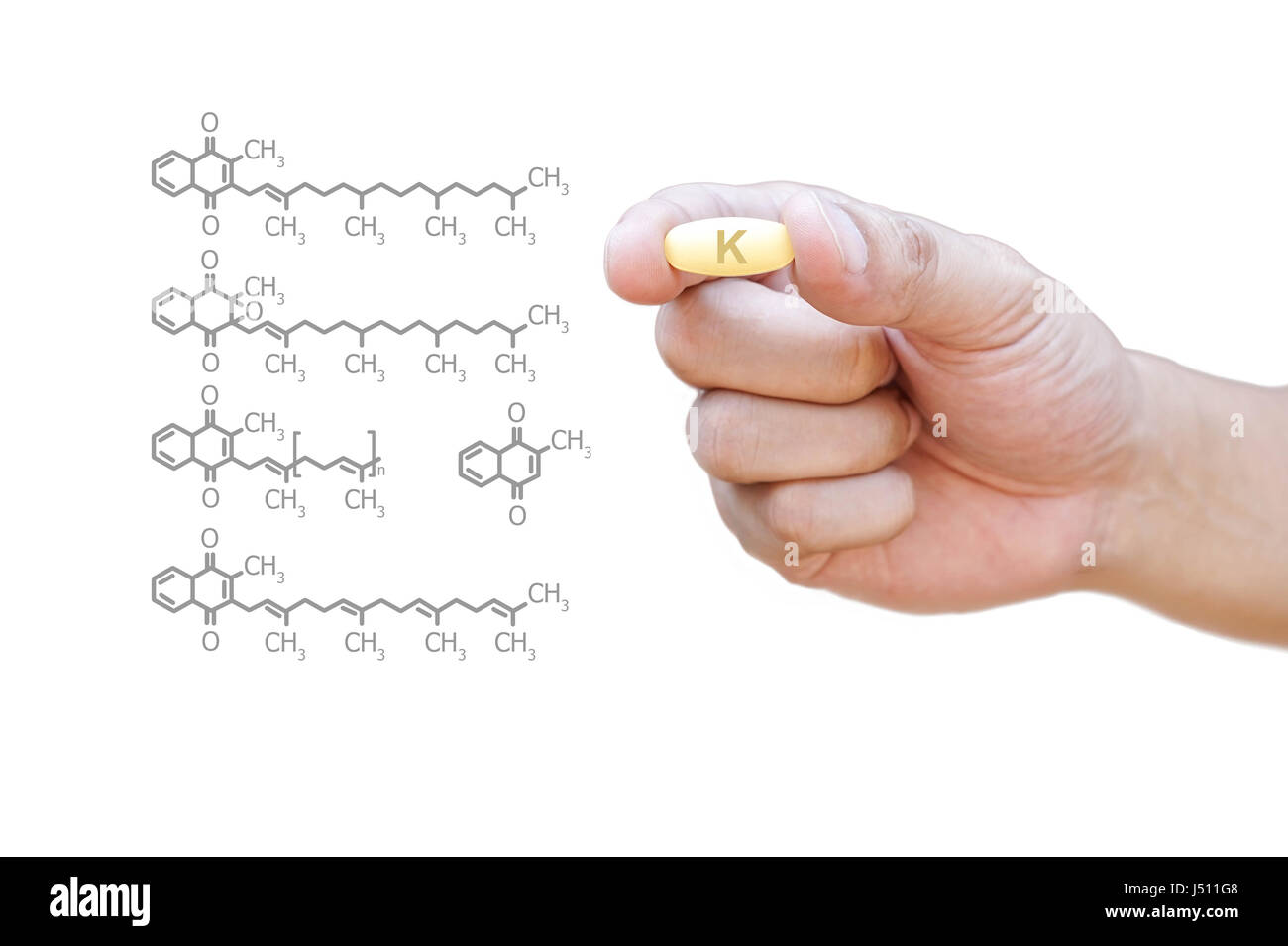 Hand holding vitamin K pill with clipping path Stock Photo - Alamy