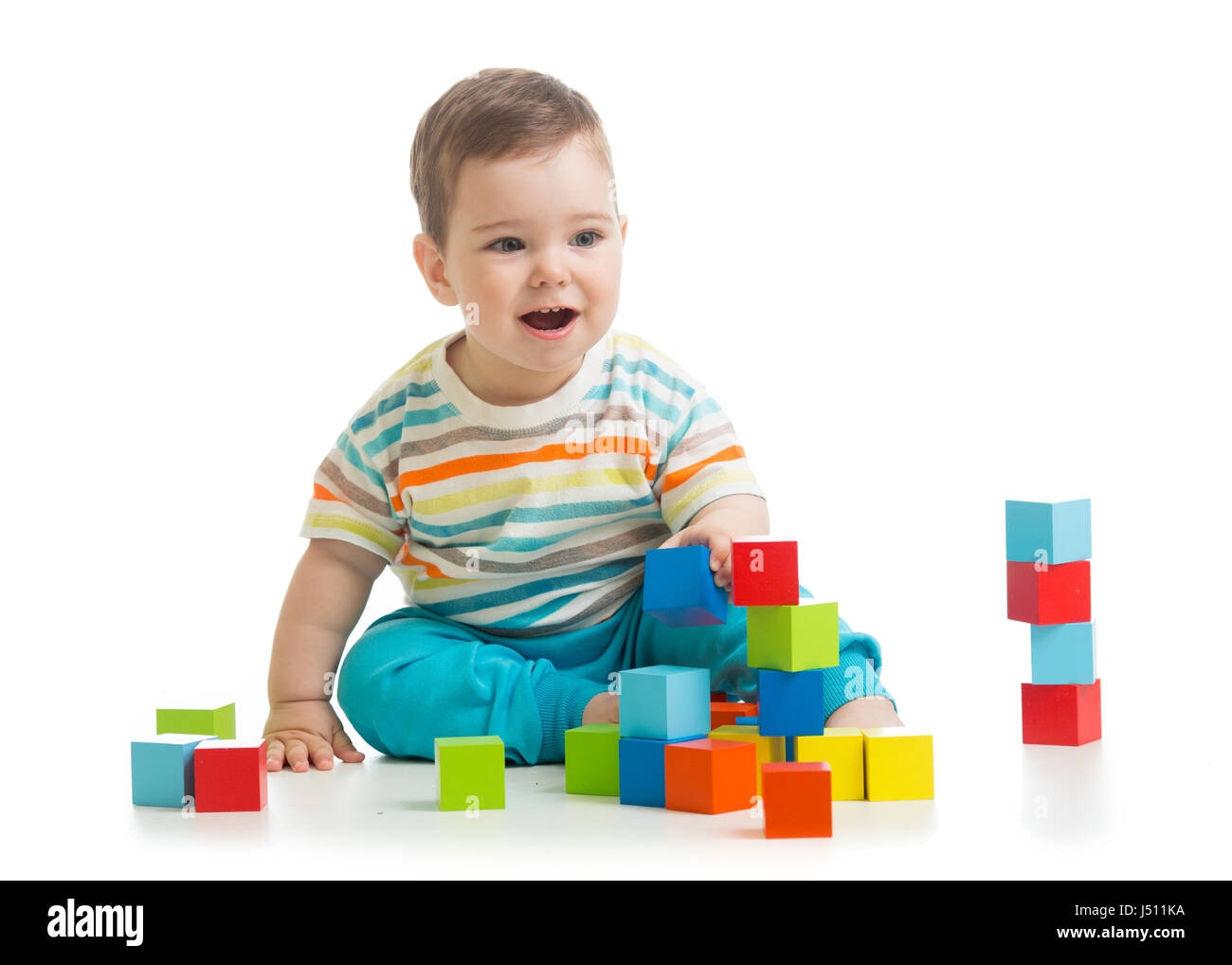 Baby building from toy blocks. Isolated on white background Stock Photo ...