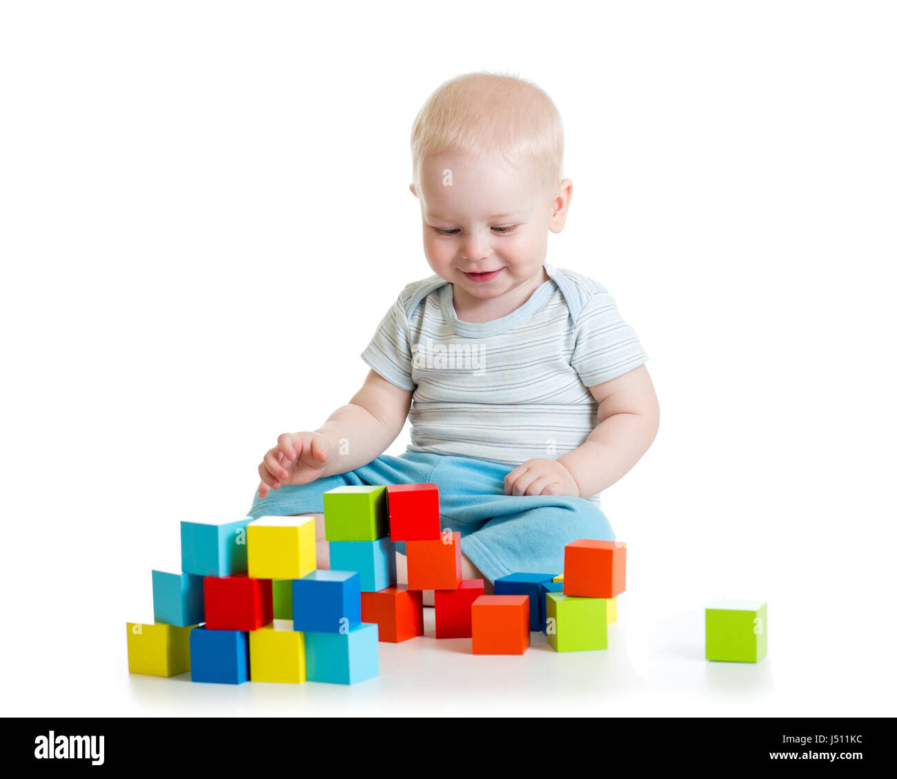 Kid building from toy blocks. Isolated on white background Stock Photo ...