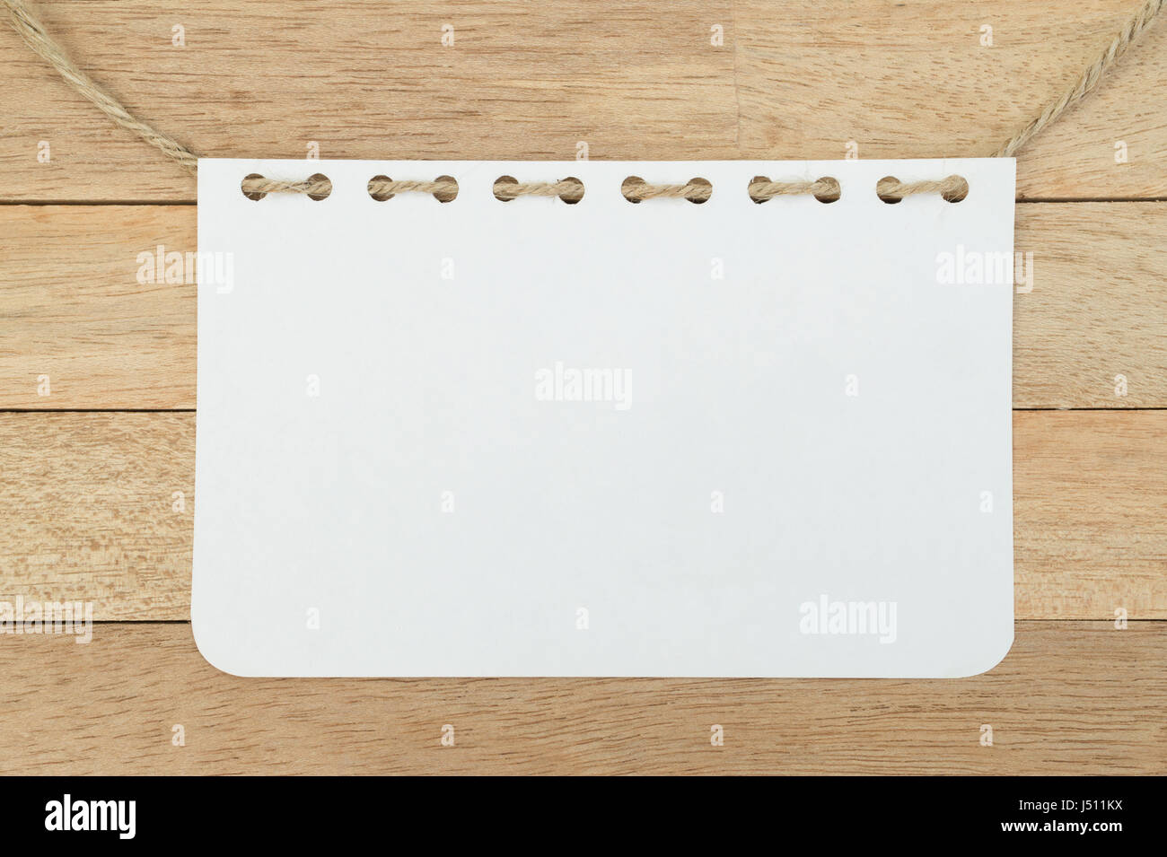 Blank notebook sheet with rope on wood background Stock Photo - Alamy