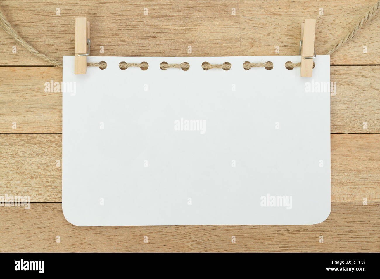 Blank notebook sheet with rope on wood background Stock Photo - Alamy