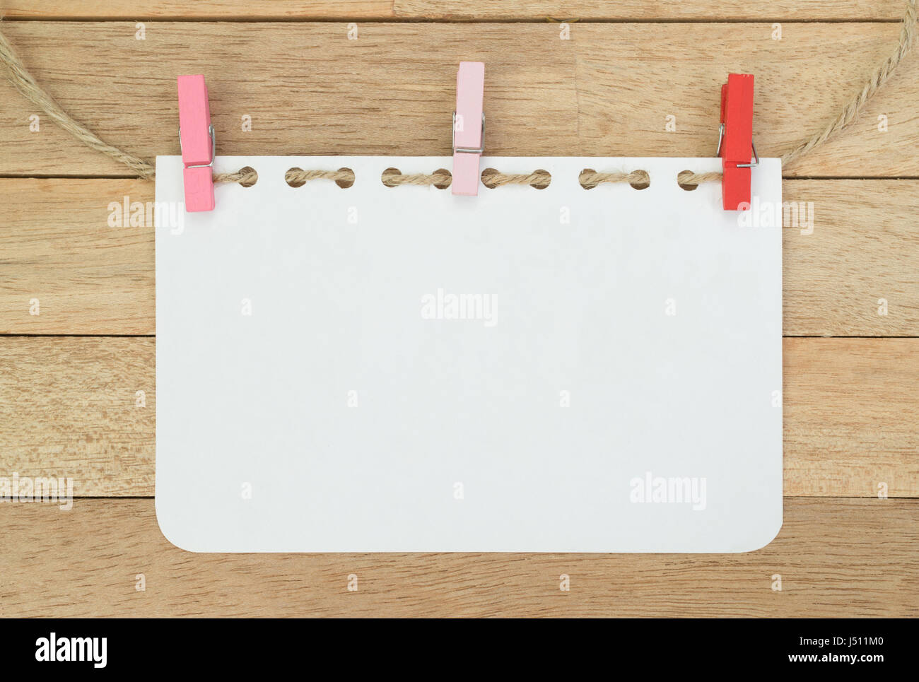 Blank notebook sheet with rope on wood background Stock Photo - Alamy