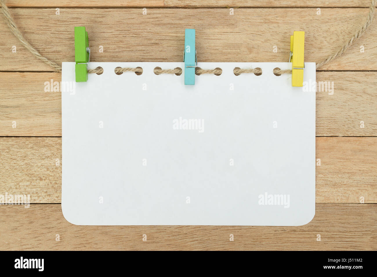 Blank notebook sheet with rope on wood background Stock Photo - Alamy