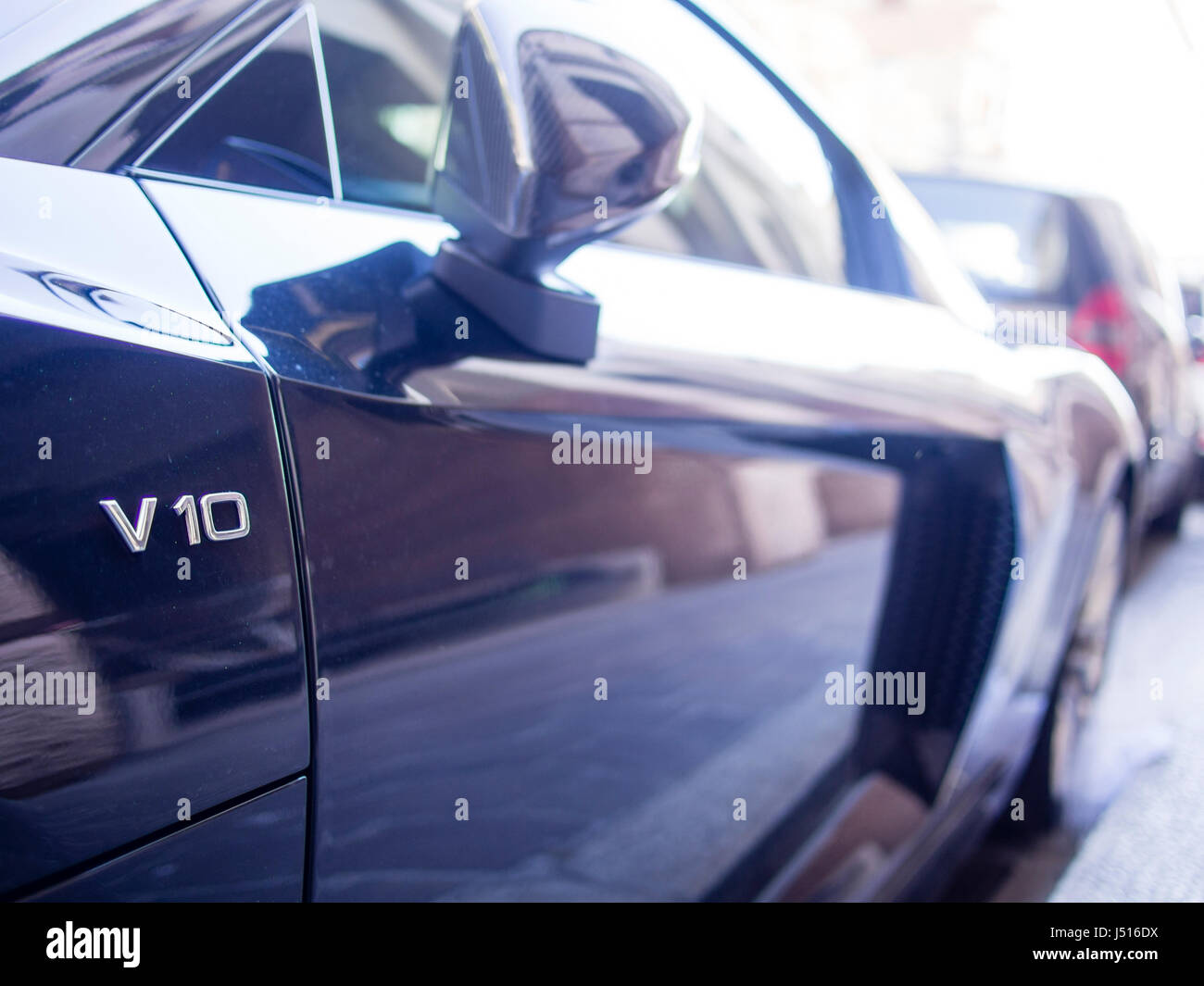black Audi R8 V10 emblem with optical bokeh effect Stock Photo - Alamy
