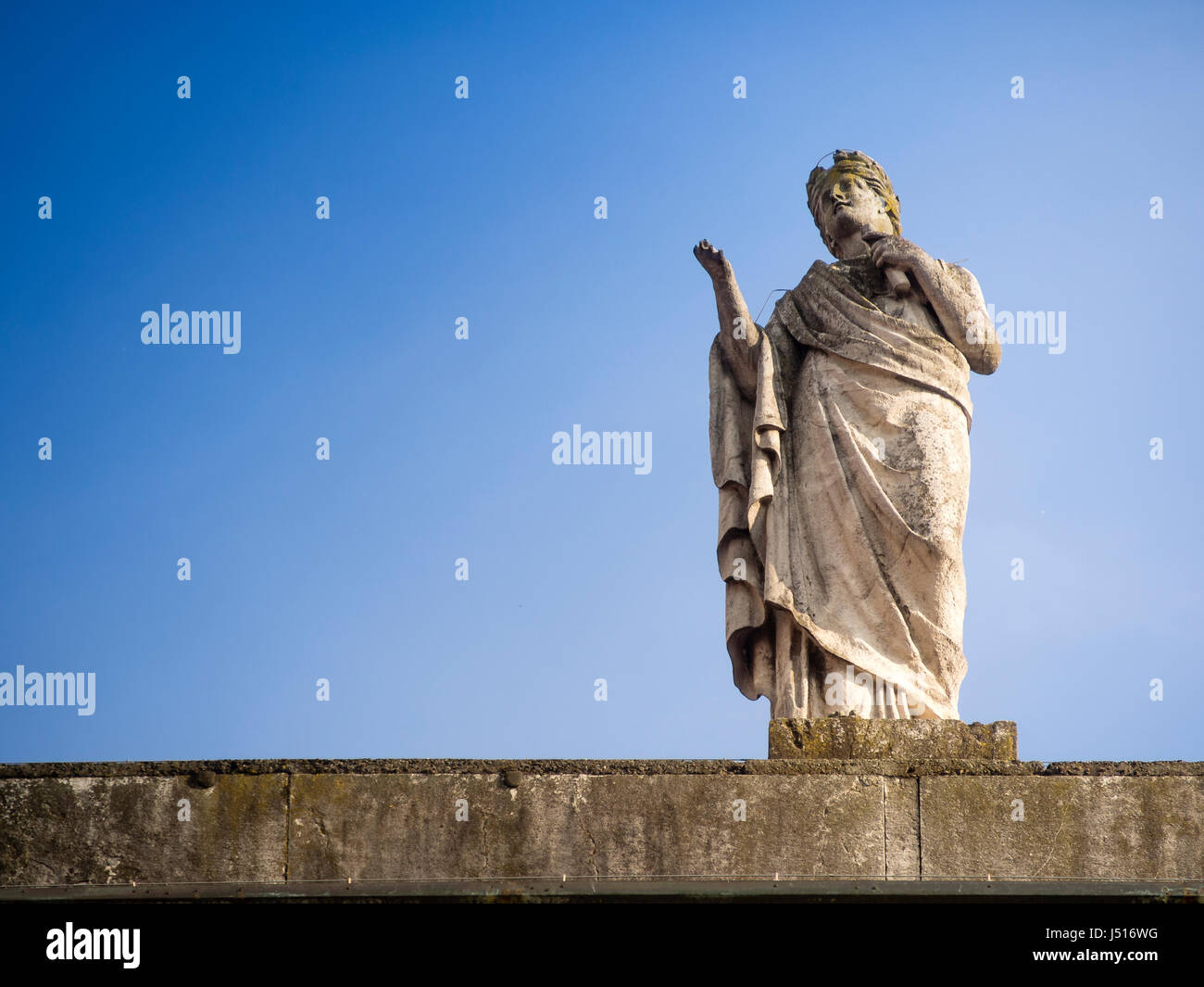 Statue in a roof Stock Photo - Alamy
