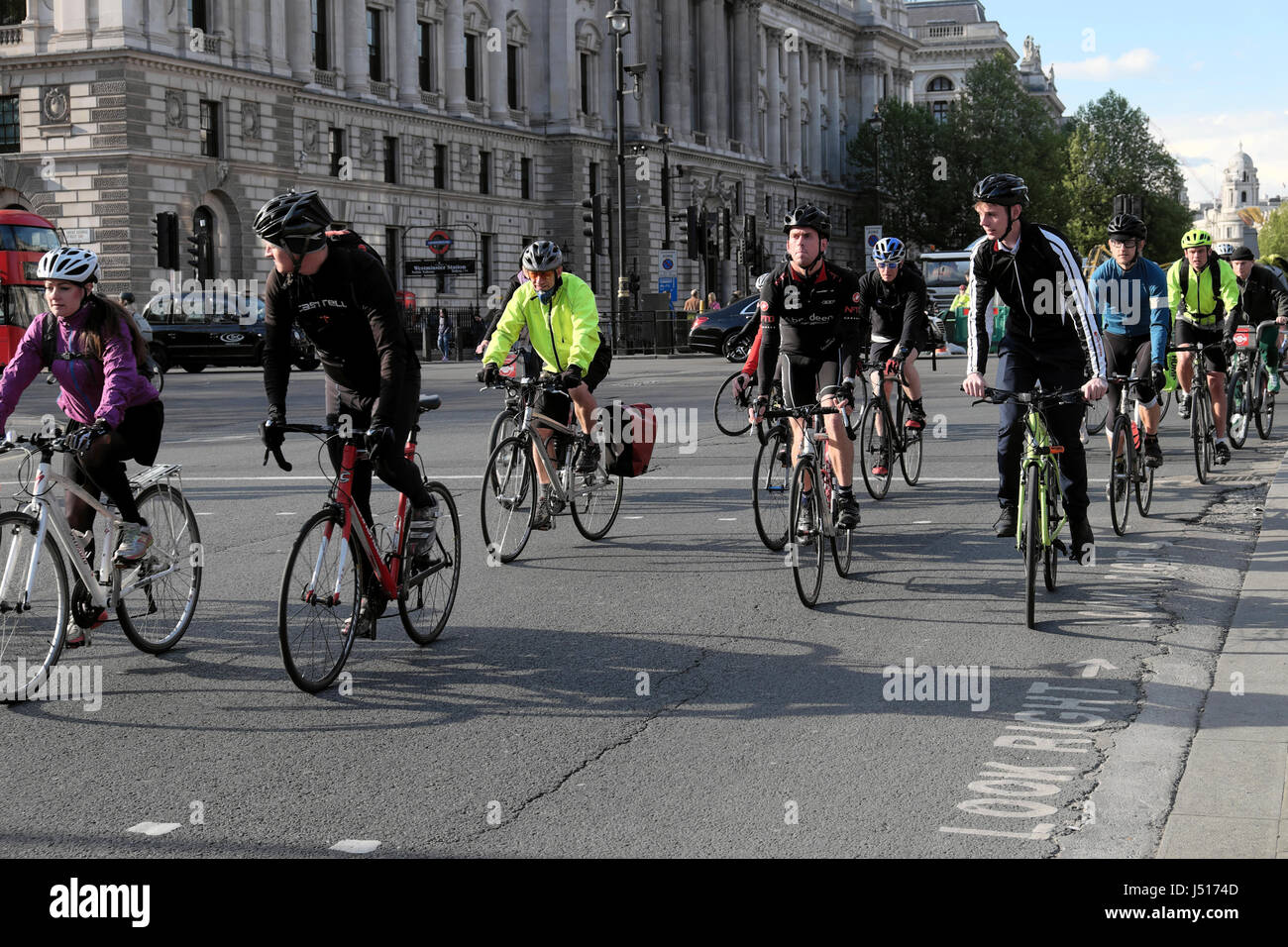 Commuters cyclists commute people riding bikes near Parliament Square ...