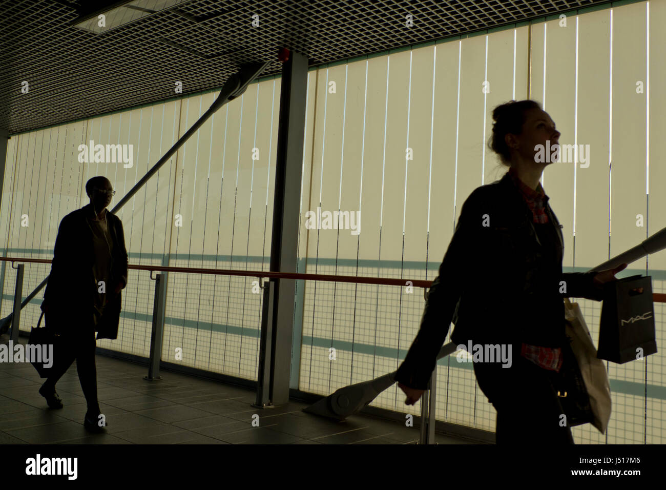 Shadows of passengers at rush hour in a station in Birmingham,UK Stock ...