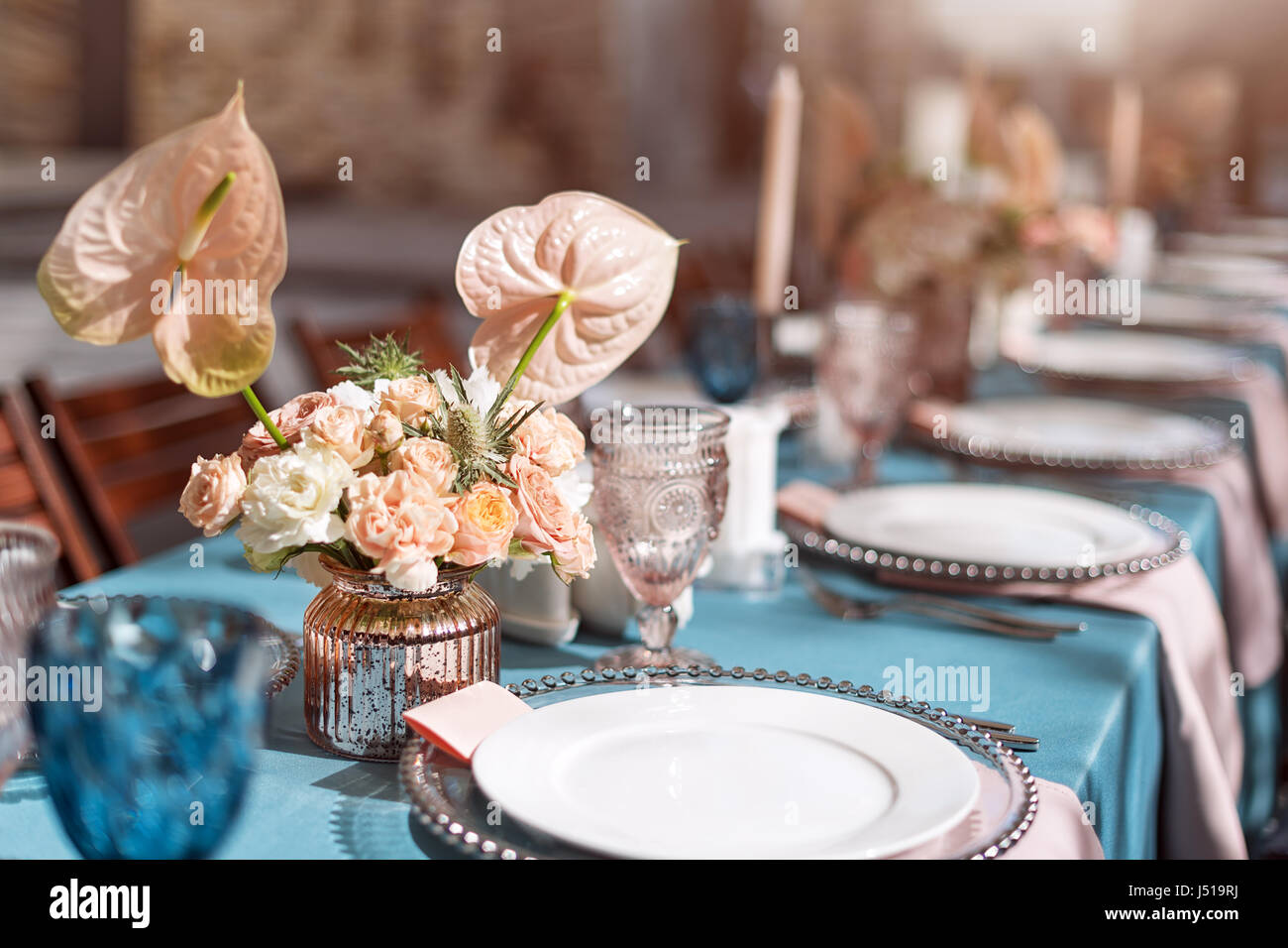 Flower table decorations for holidays and wedding dinner. Table set for ...