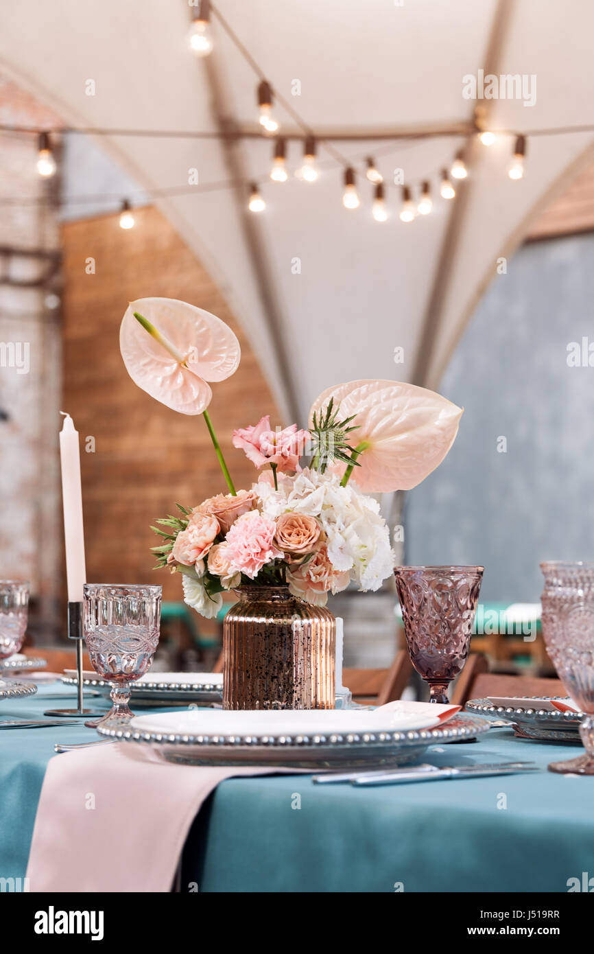 Flower table decorations for holidays and wedding dinner. Table set for ...