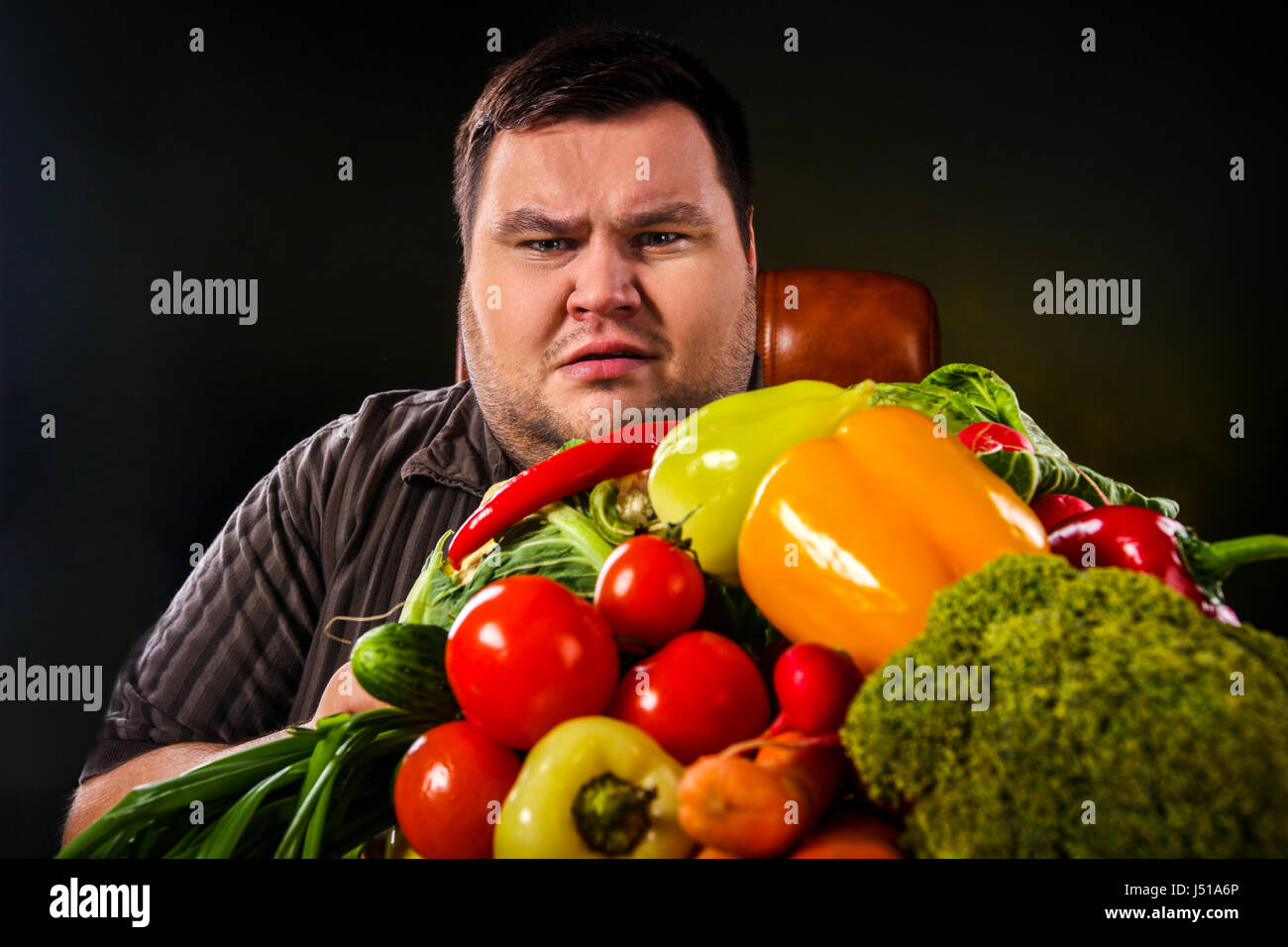 Diet fat man eating healthy food . Healthy breakfast with vegetables ...