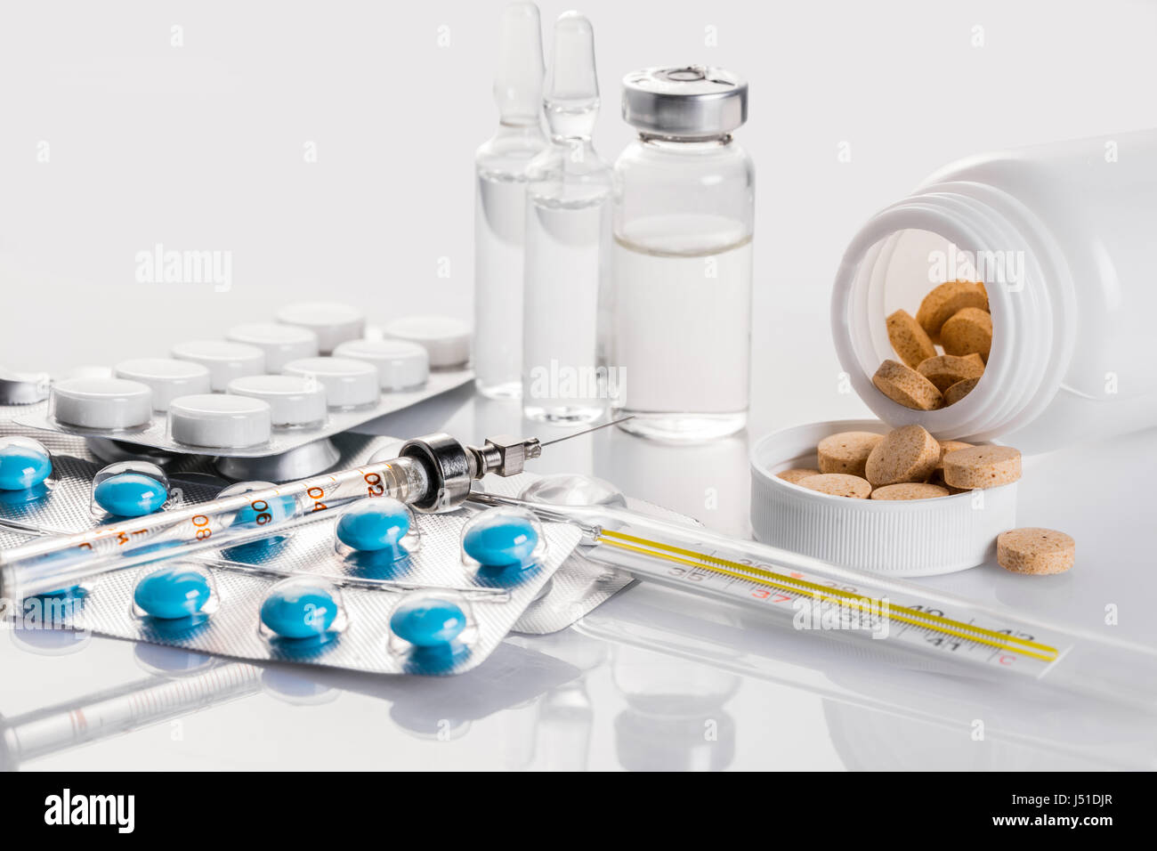 medications close-up, tablets and syringes lying on the table Stock ...