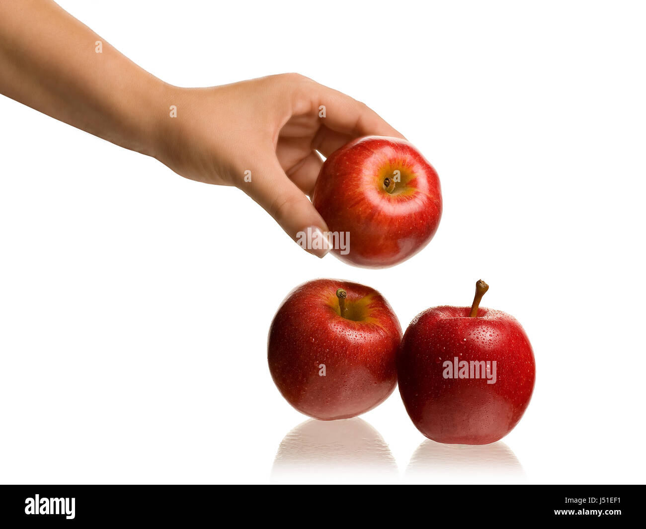 Hand with apples Stock Photo - Alamy