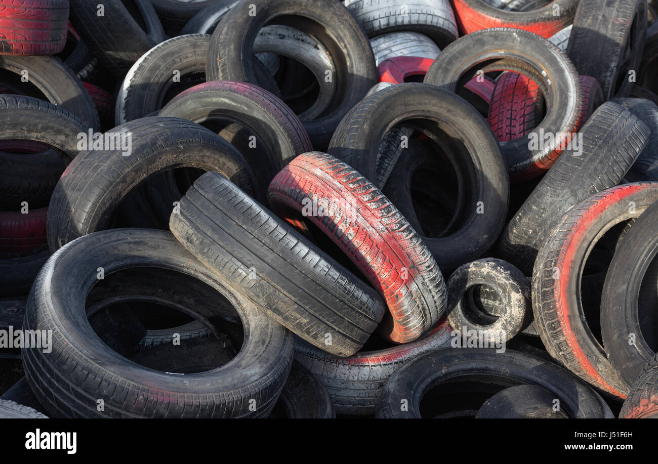 Variety of waste tyres dumped in a big pile Stock Photo - Alamy