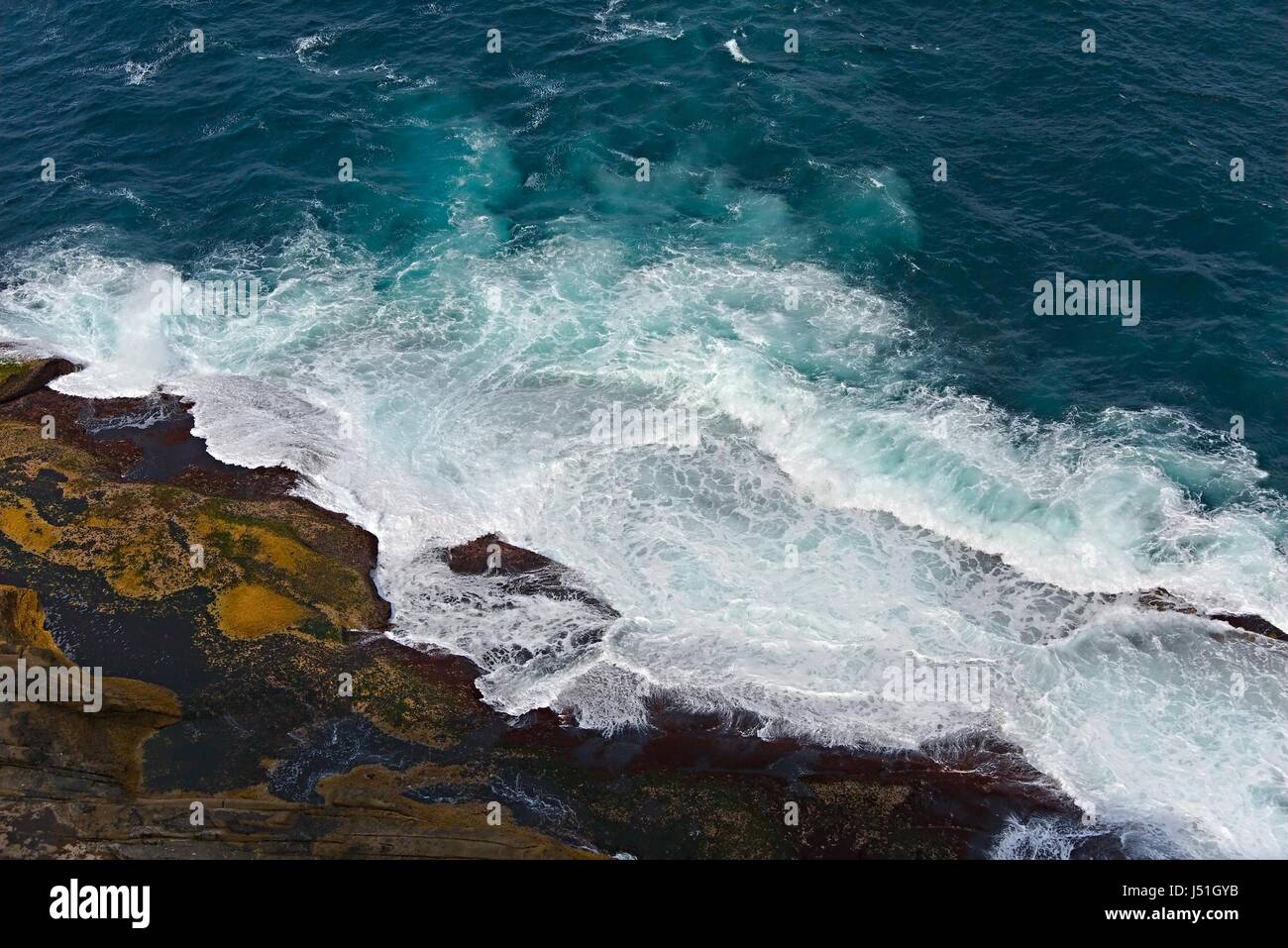 Waves hitting shore Stock Photo - Alamy