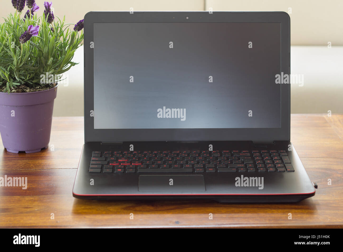 Table with laptop hi-res stock photography and images - Alamy