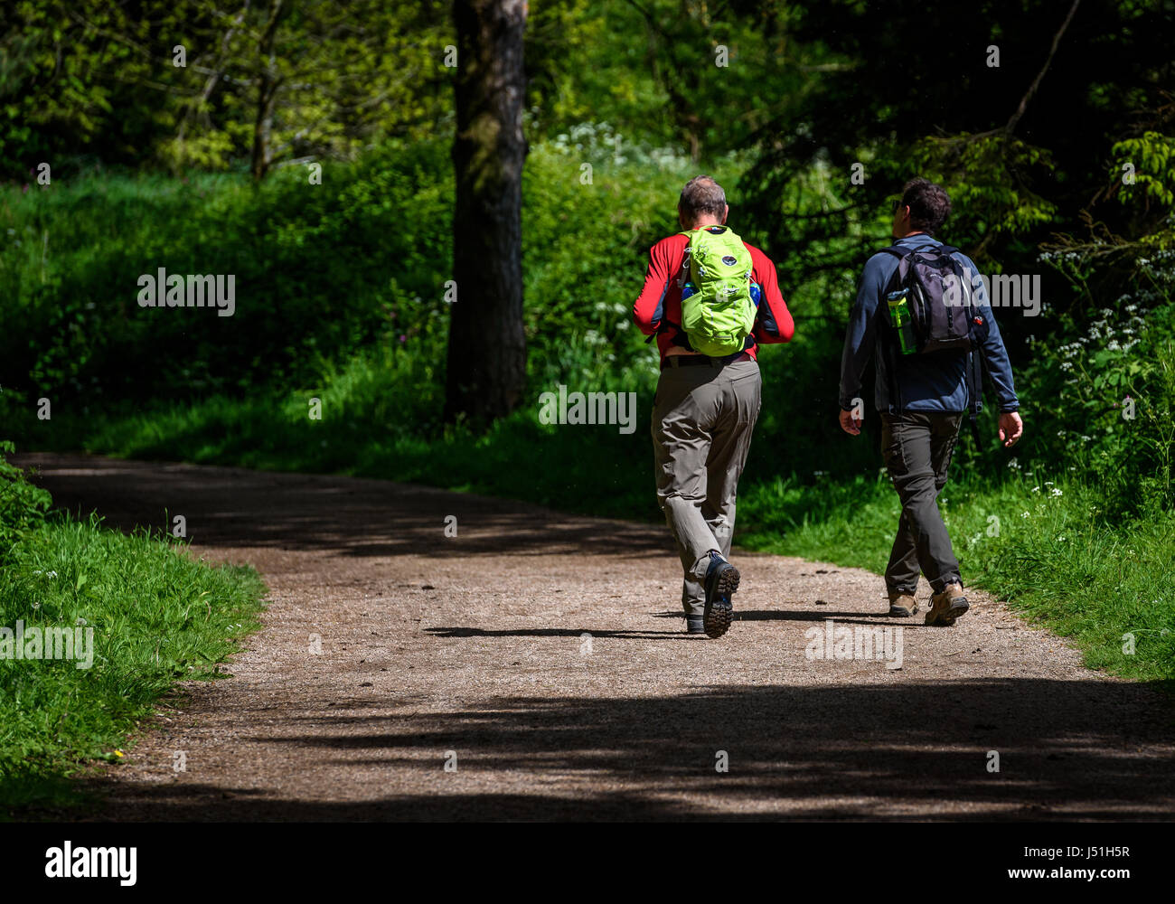 Two men walking down a road hi-res stock photography and images - Alamy