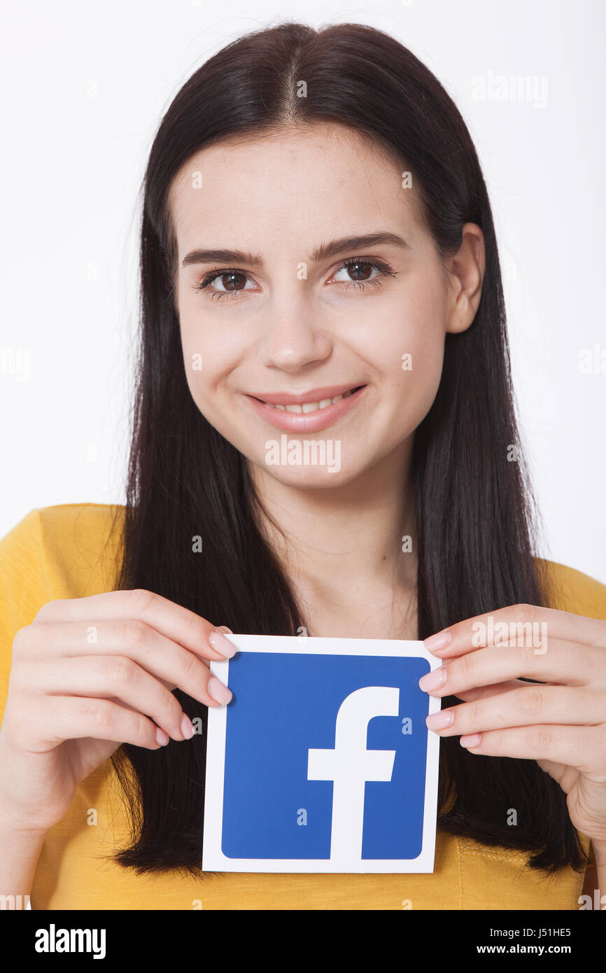 KIEV, UKRAINE - August 22, 2016: Woman hands holding facebook icon sign ...