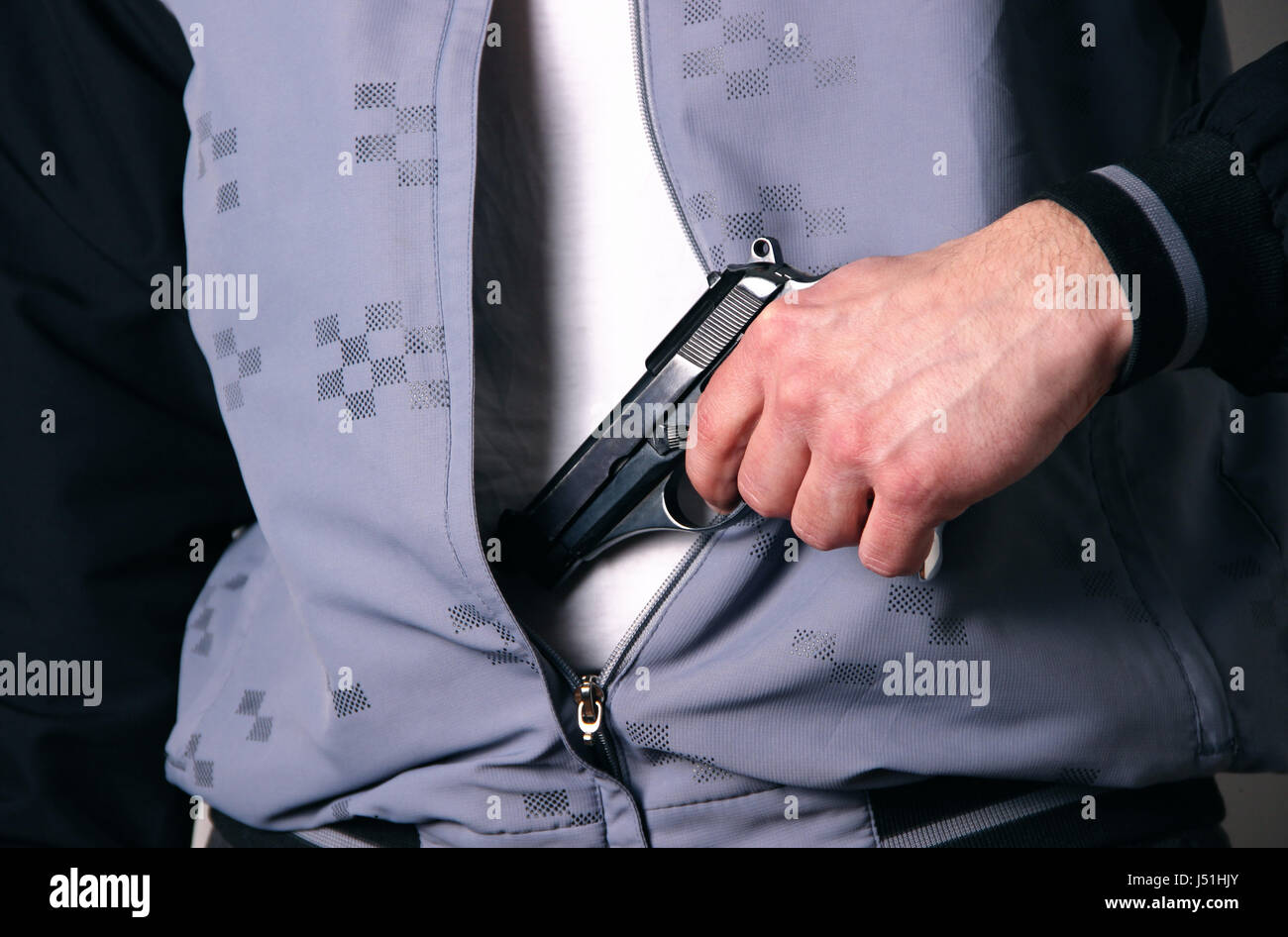 Gun in the hand Stock Photo - Alamy