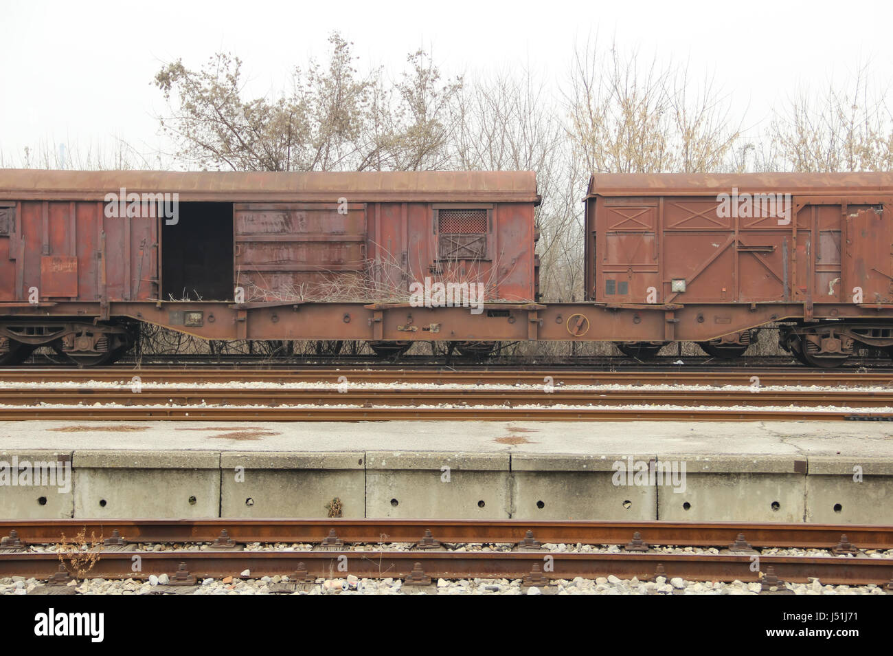 Rusty old wagon on the rails Stock Photo - Alamy