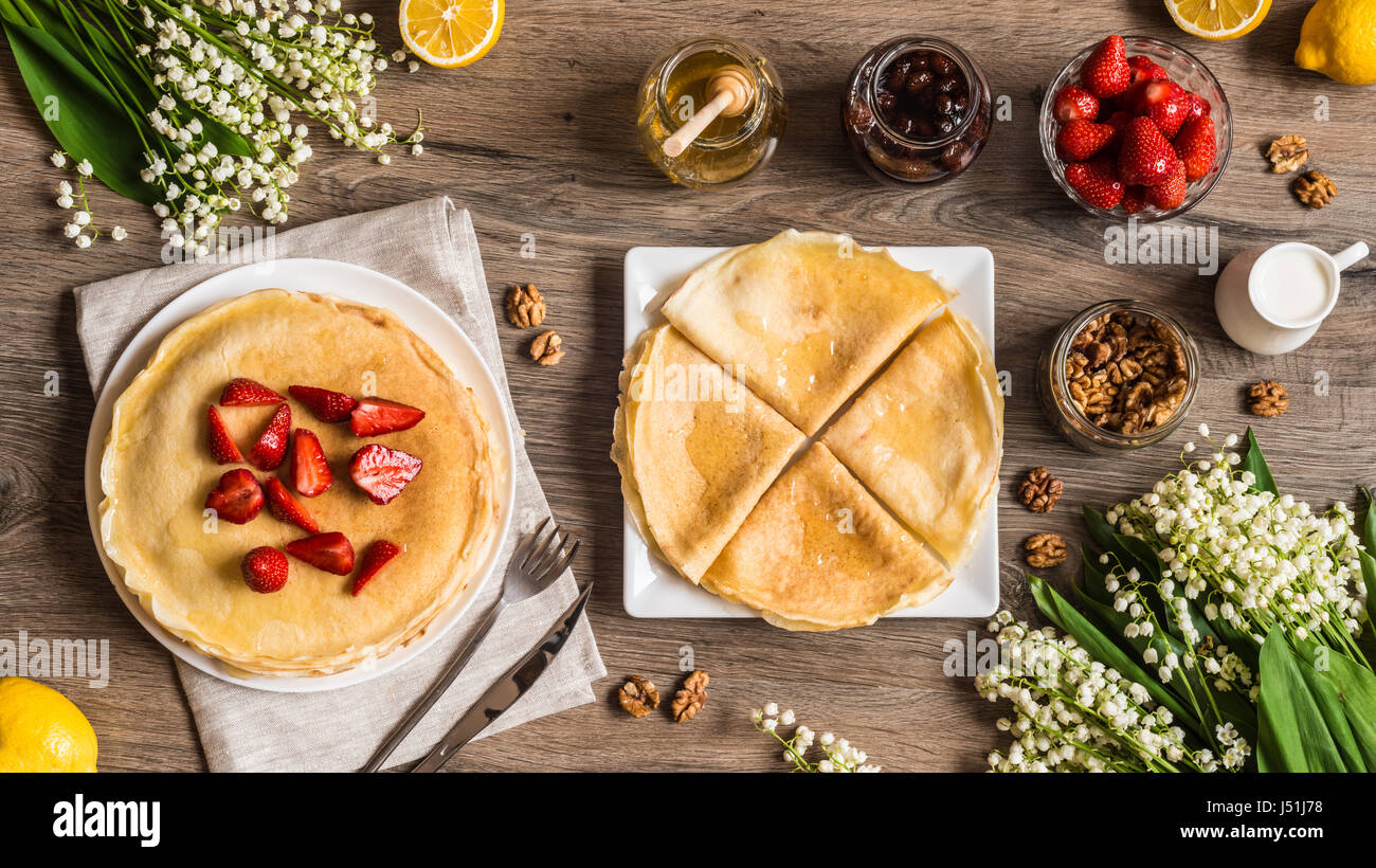 top view delicious pancakes on wooden table with fruits Stock Photo - Alamy