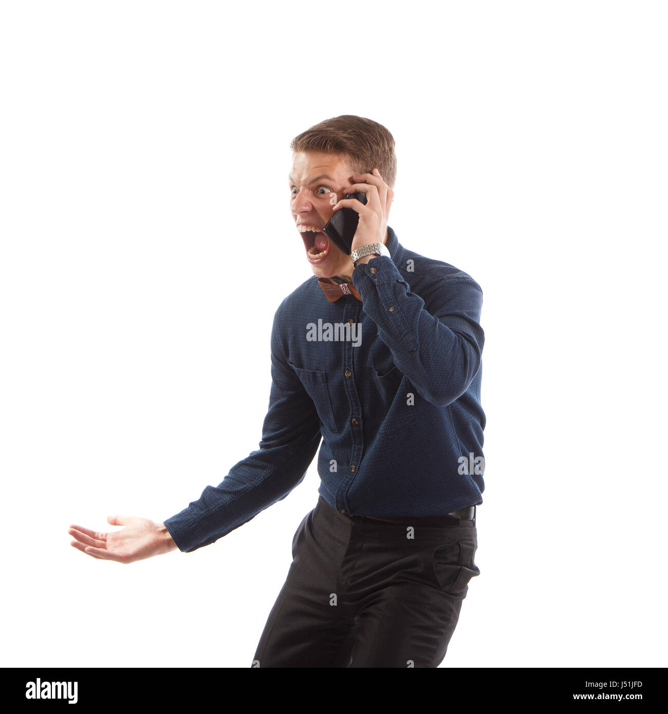 A man having an angry reaction while talking on the phone Stock Photo ...