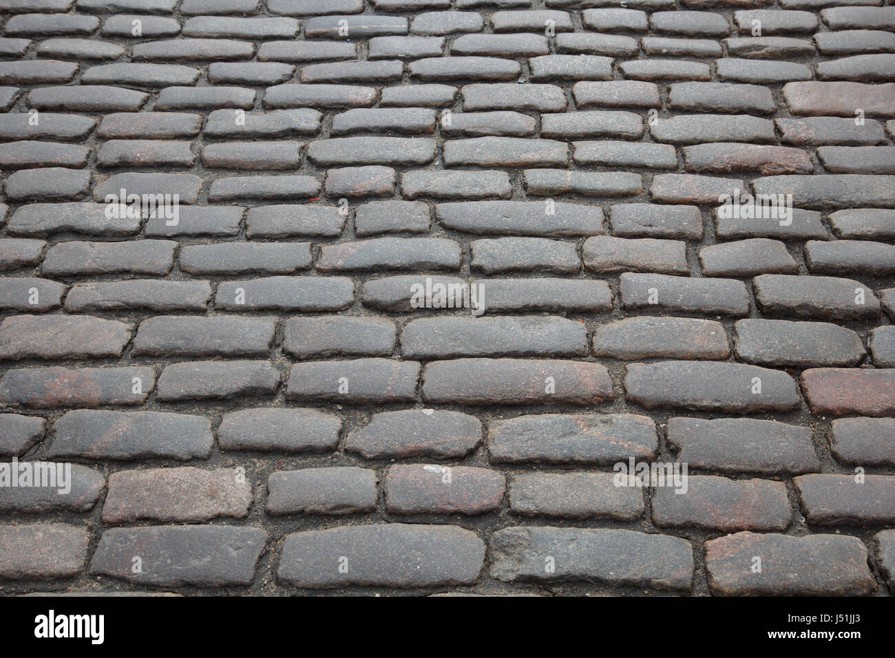 An old, traditional stone brick street road Stock Photo - Alamy