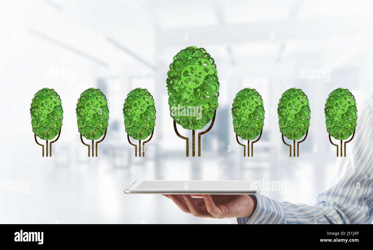 Eco green environment concept presented by tree as working mechanism or ...