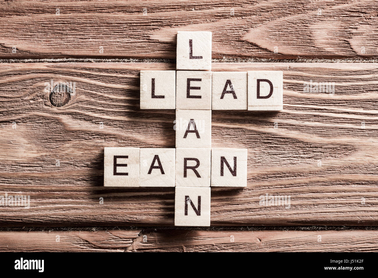 Conceptual keywords on wooden table with elements of game making ...