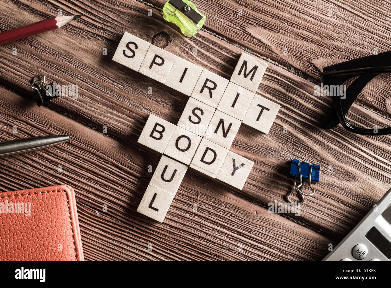 Conceptual keywords on wooden table with elements of game making ...